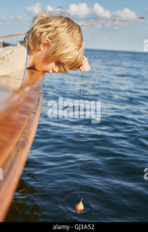 Fishing with a float rod Stock Photo - Alamy