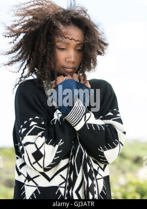 Woman With Warm Clothing Feeling The Cold Inside House on the sofa she ...