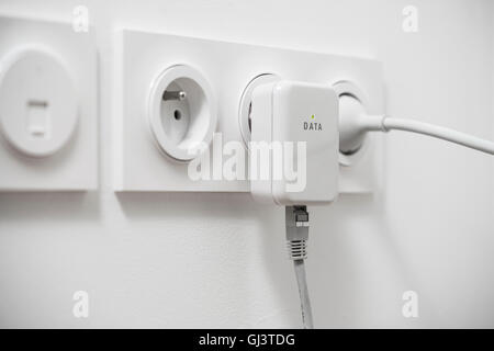 Powerline network adaper plugged into a wall socket - The Netherlands ...