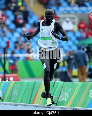 Yiech Pur Biel of the Refugee Olympic Team, rear right, runs at the ...