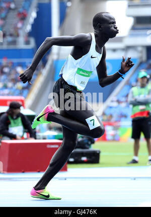 Yiech Pur Biel of the Refugee Olympic Team, rear right, runs at the ...