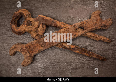 rusted tools on a slate background Stock Photo - Alamy