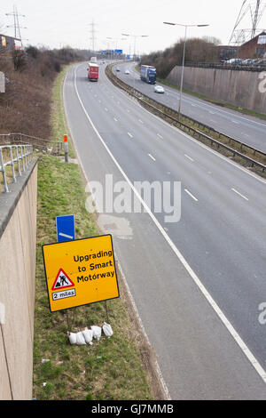 Smart motorway warning sign in rain for "High winds and rain forecast ...