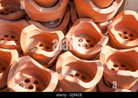 stacked red stone pots in an pottery Stock Photo - Alamy