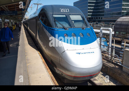 An Amtrak Acela high speed passenger train passes through the Old ...