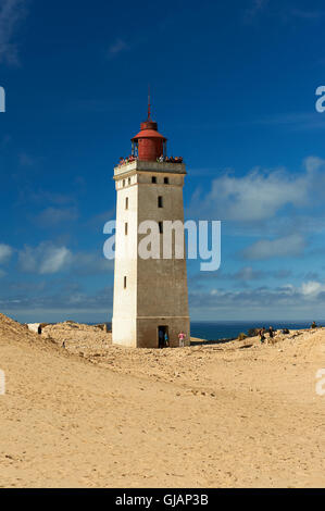 The old lighthouse, partially burried in sand, at Rubjerg Knude ...