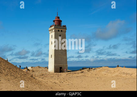 The old lighthouse, partially burried in sand, at Rubjerg Knude ...