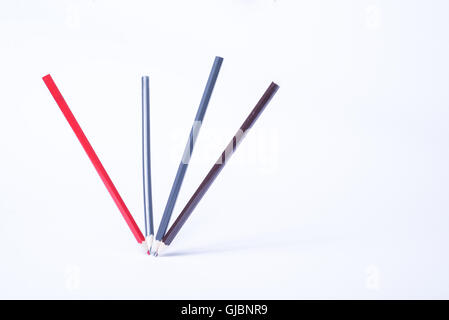 four dancing pencils as still life on white background Stock Photo - Alamy