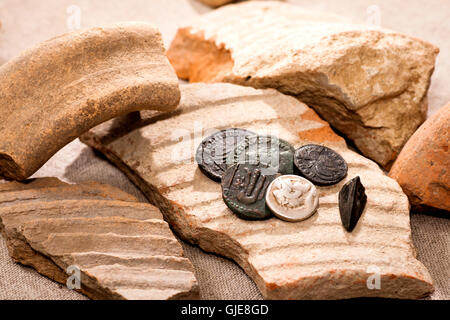 Ancient jug and coins Archaeological artifact on display at the ...