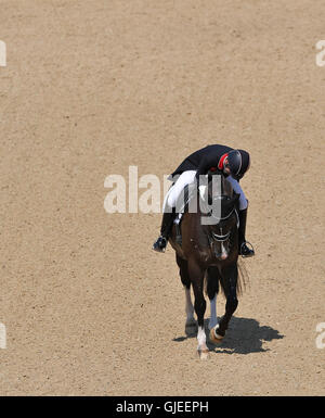 Great Britain's Charlotte Dujardin celebrates winning bronze in the ...