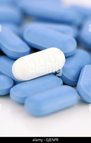 White caplet on blue caplets background Stock Photo - Alamy