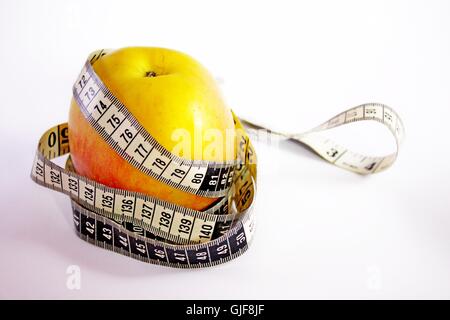 An apple with a meter Stock Photo - Alamy