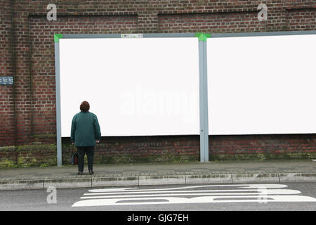A woman in black mantle - the image of a witch on Halloween in dark ...