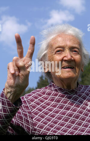 woman sign signal laugh laughs laughing twit giggle smile smiling ...