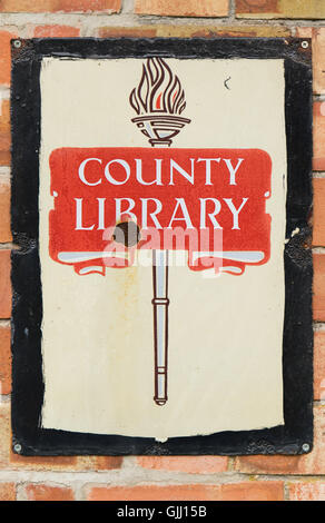 Vintage Enamel County Library Sign fixed to a brick wall Stock Photo ...