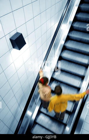 escalator stairs humans Stock Photo - Alamy
