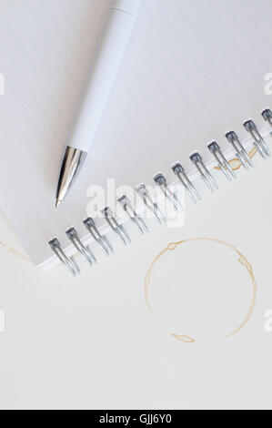 Coffee Stains and Notebook on White Background Stock Photo - Alamy