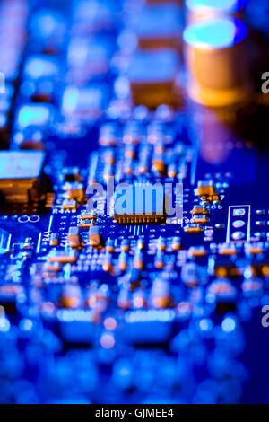 Macro picture of computer electronics with people sitting Stock Photo ...