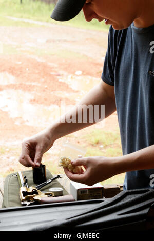 A man loading an antique black powder muzzleloading shotgun on a game ...