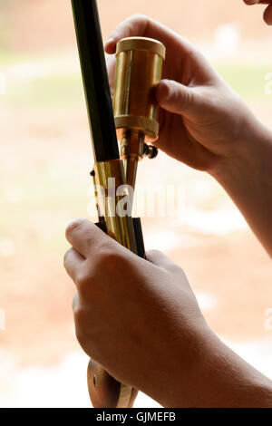 Loading a revolver Stock Photo - Alamy