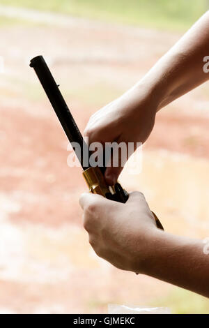 A man loading an antique black powder muzzleloading shotgun on a game ...