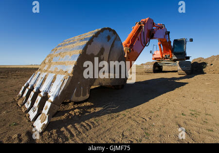close up of a demolition claw working picking up debris in the wreckage ...