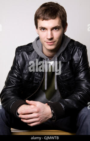 Handsome man in bright jacket with speech bubble Stock Photo - Alamy