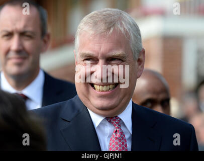 The Duke of York laughs as he visits the parade ring during day one of ...