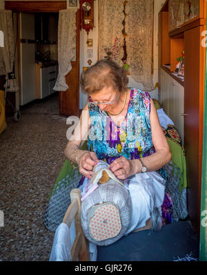 Lacemaker - woman making traditional lace with bobbins in Auvergne ...