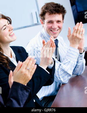 Happy casual woman clapping being supportive wearing hoodie over yellow ...