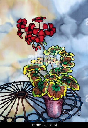 red geranium in a pot on display Stock Photo - Alamy