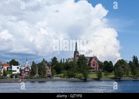 UMEÅ, SWEDEN ON JULY 14, 2021. Old classic cars cruising on a country ...