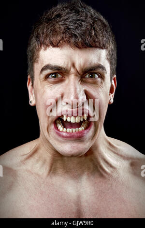 Funny face with glancing eyes and grimace on the mouth drawn on a ...
