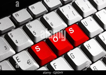 Red sos key on keyboard Stock Photo - Alamy