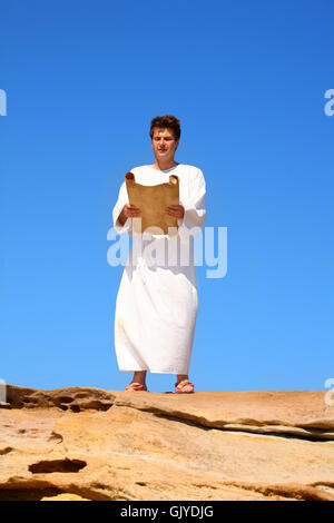 Biblical man reading scroll scripture Stock Photo - Alamy