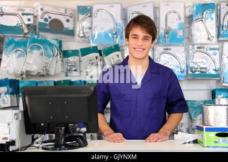 friendly seller in hardware store Stock Photo - Alamy