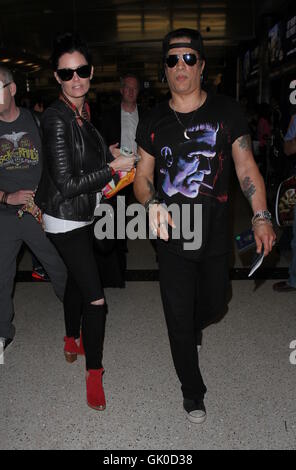 Slash and a female companion at Los Angeles International Airport (LAX ...