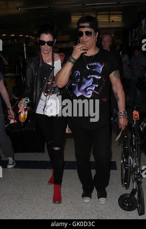 Slash and a female companion at Los Angeles International Airport (LAX ...