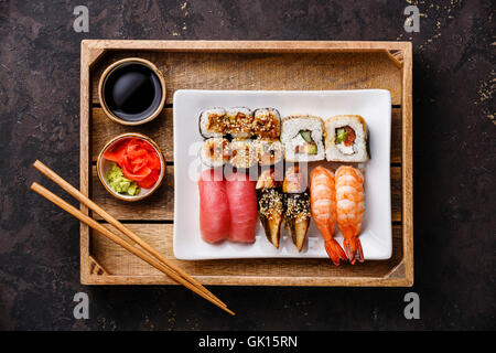 Roll with fish sushi with chopsticks - asian food concept Stock Photo ...