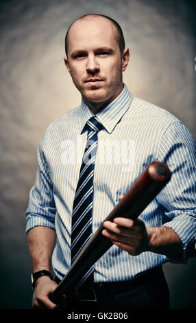 Businessman with baseball bat isolated on white Stock Photo - Alamy