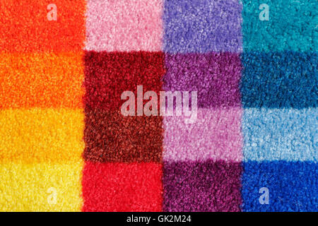 Closeup detail of multi color carpet texture background Stock Photo - Alamy