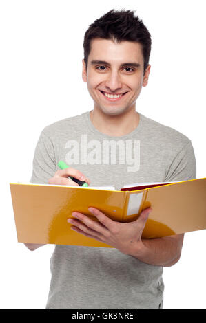 smiling young man studying with a dossier (isolated on white background ...