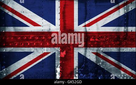 old faded union jack flag flying in wind in sun Stock Photo - Alamy