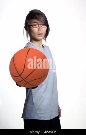Asian female basketball player and ball Stock Photo - Alamy