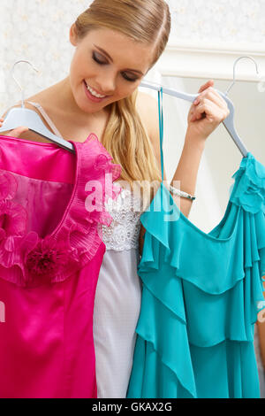 Photo of elegant woman choosing a new car in automobile center Stock ...