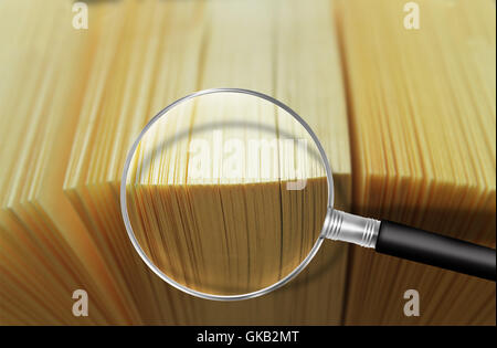 Open book with a magnifying lupe Stock Photo - Alamy