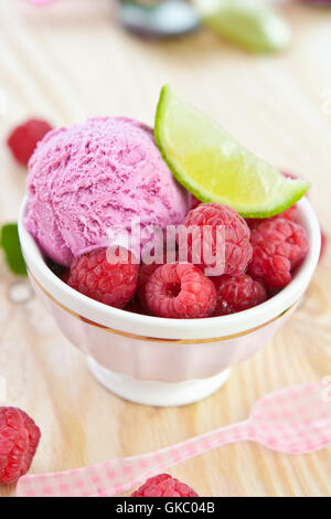 raspberries with ice cream in pink chocolate Stock Photo - Alamy