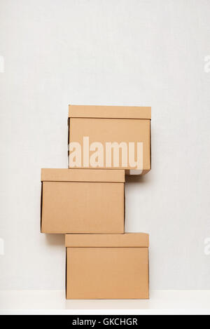 Many closed cardboard boxes on floor indoors. Delivery service Stock ...