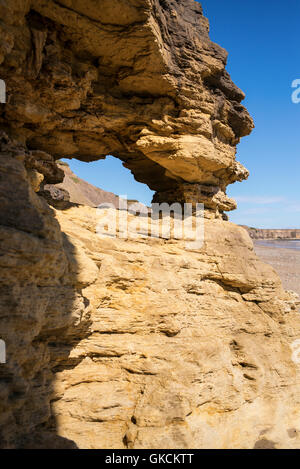 Cliffs of yellow coloured Magnesian Limestone rock at Seaham Beach ...