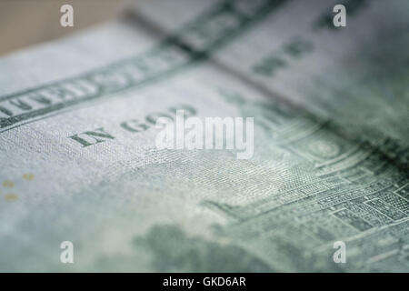 Closeup of new American hundred dollar bill (backlit to show watermarks ...